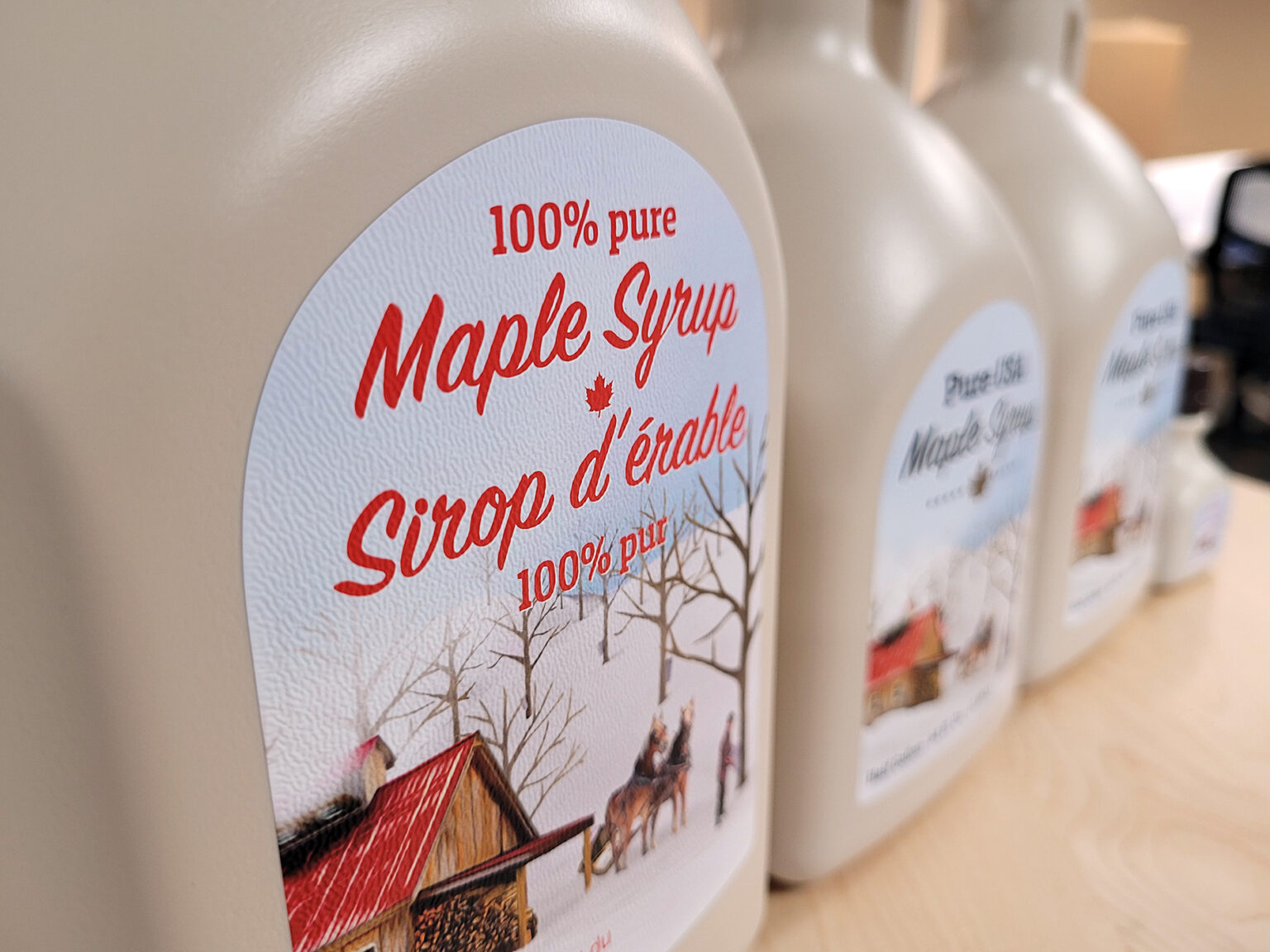 A unique jug labeling process in the maple syrup industry - Les ...